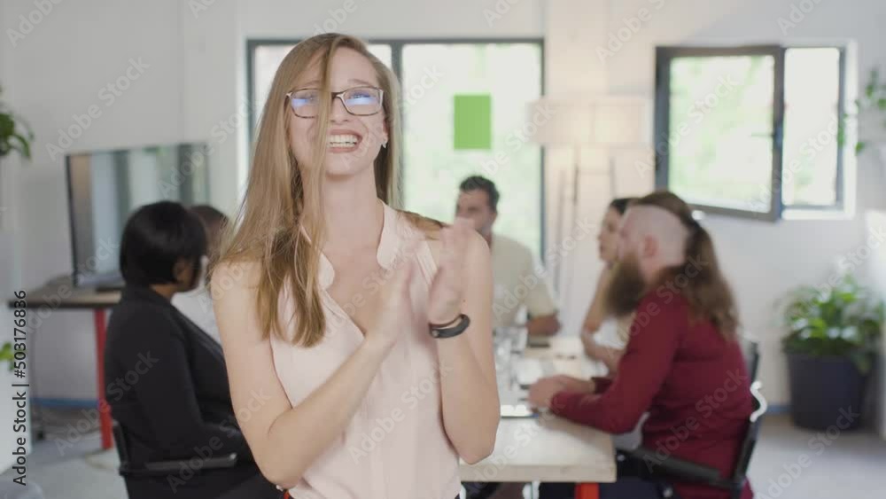 Confident young businesswoman portrait giving applause and like ...