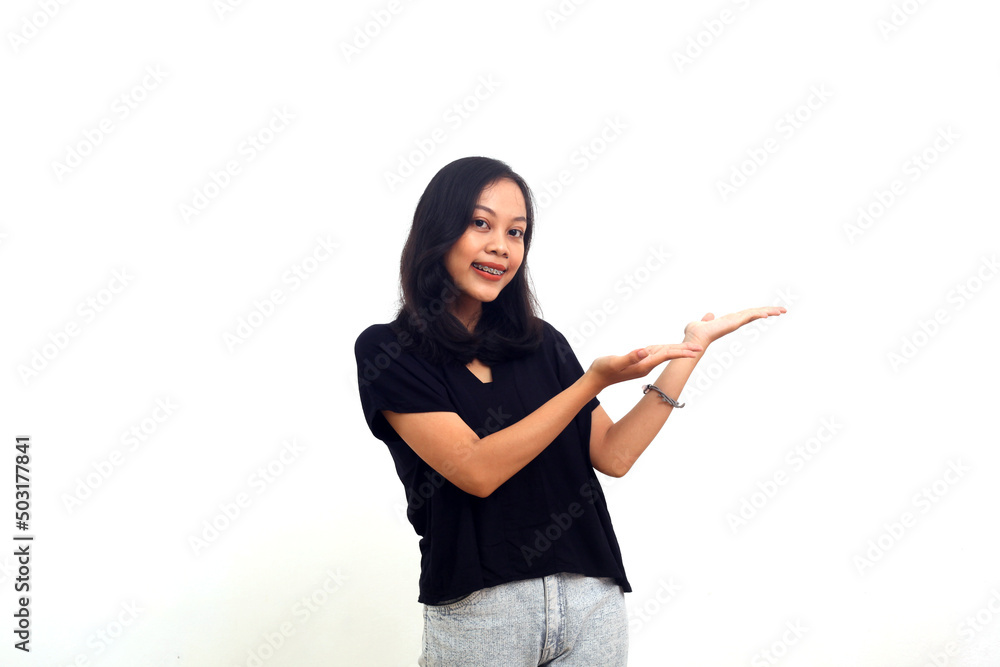 Asian girl presenting with two hand on upper left side with smile face ...