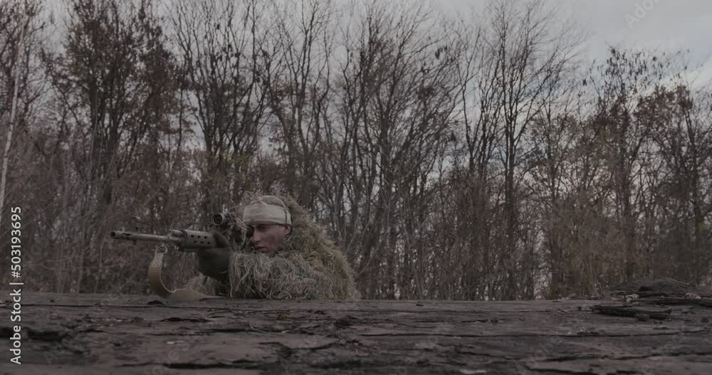 Soldier with a sniper rifle on a military operation, with a partner ...