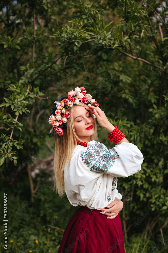 Ukrainian woman in a national Ukrainian costume and with a wreath of ...