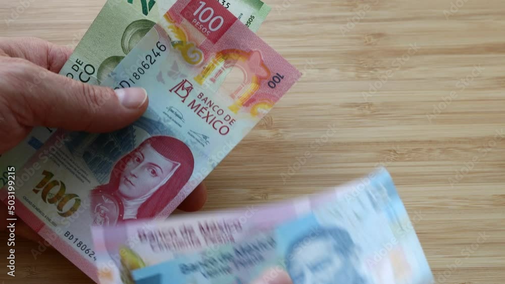 Counting mexican money, pesos banknotes, financial business concept ...