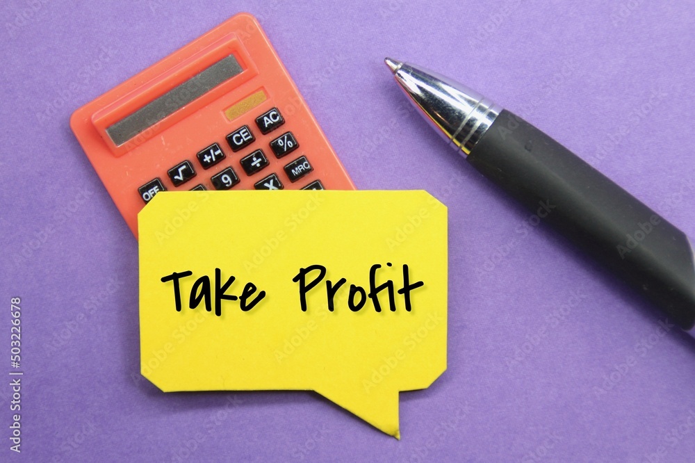 calculator, pen and conversation box with the word Take Profit Stock ...