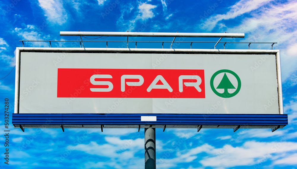 Advertisement billboard displaying logo of SPAR Stock Photo | Adobe Stock