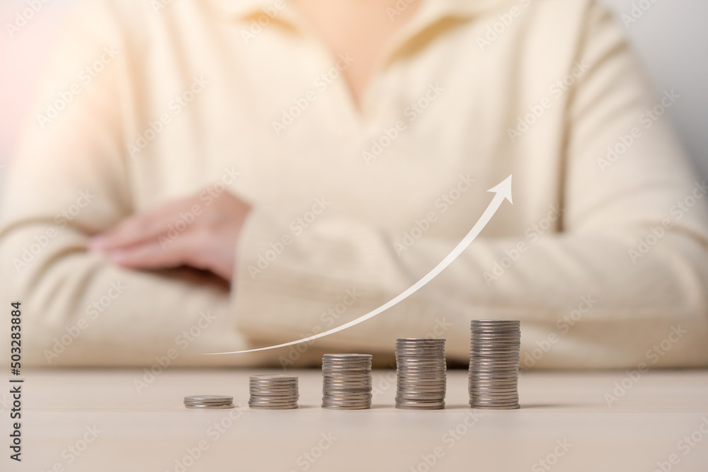 Money increasing concept with a white arrow going up. Woman sit at the ...