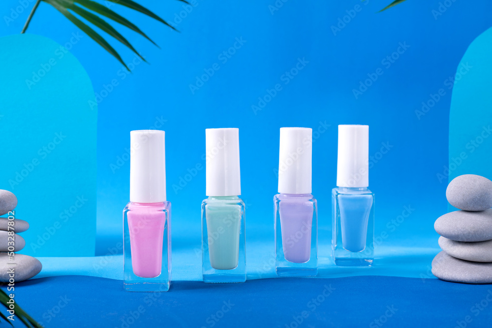Collection of nail polish of pastel colors in unlabeled vials in line ...