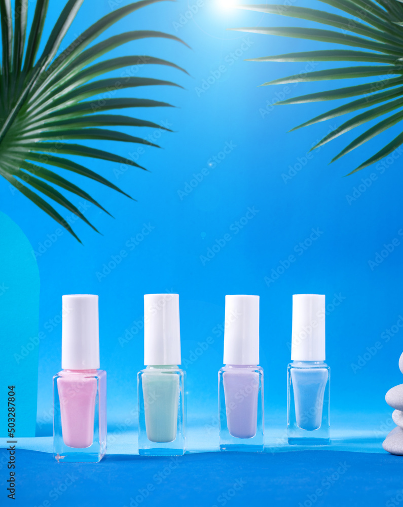 Collection of nail polish of pastel colors in unlabeled vials in line ...