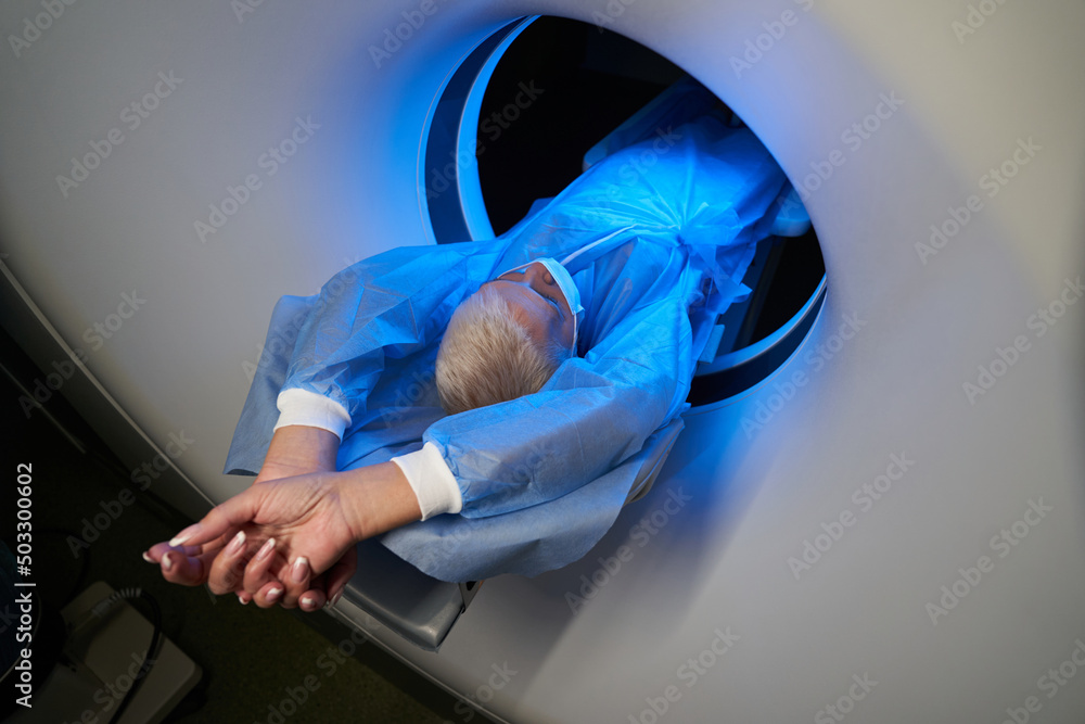 Mature woman with short hair during spectroscopy Stock Photo | Adobe Stock