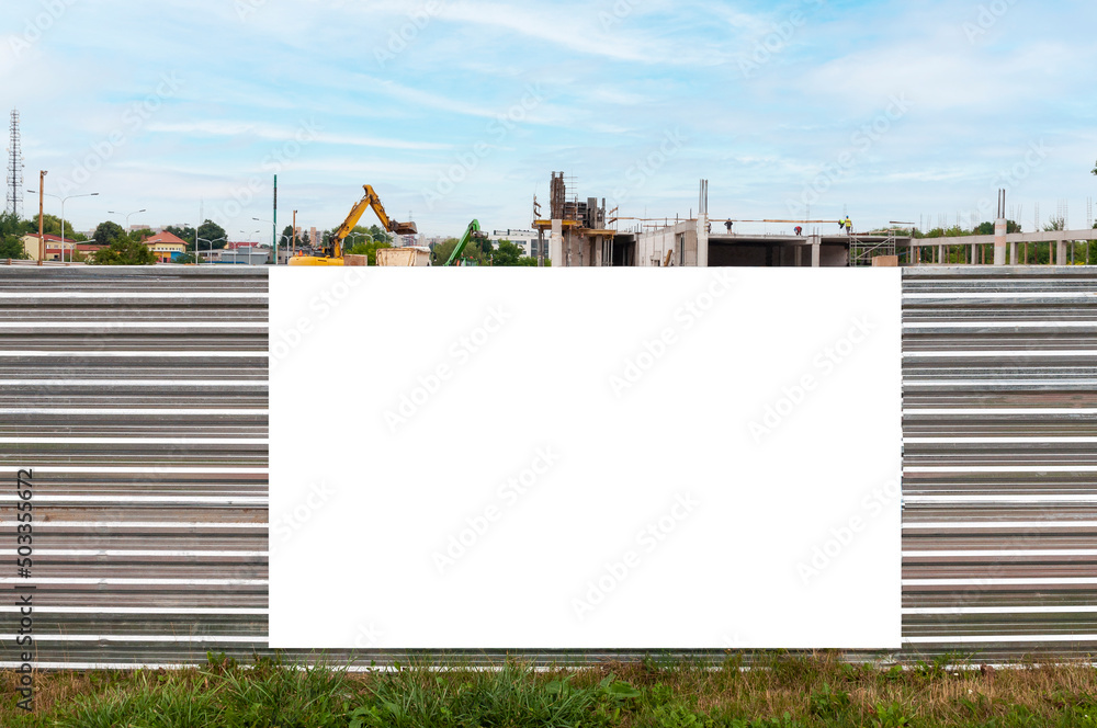 Blank white banner for advertisement on the fence of construction area ...