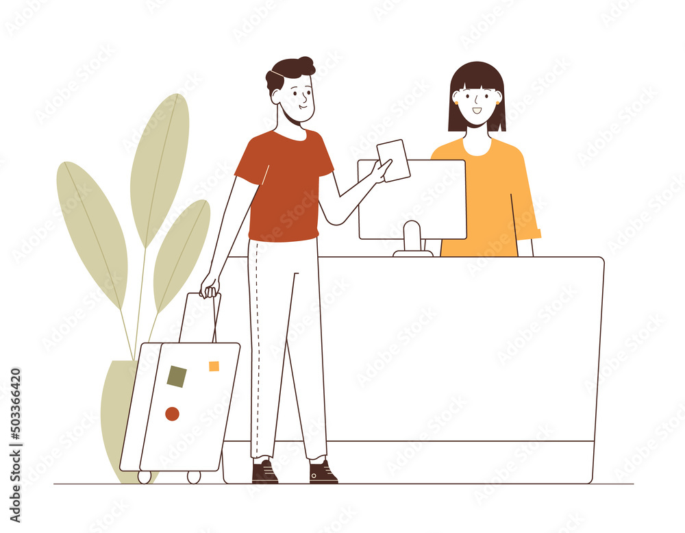 Young man standing at reception desk and booking a hotel room. Check in ...