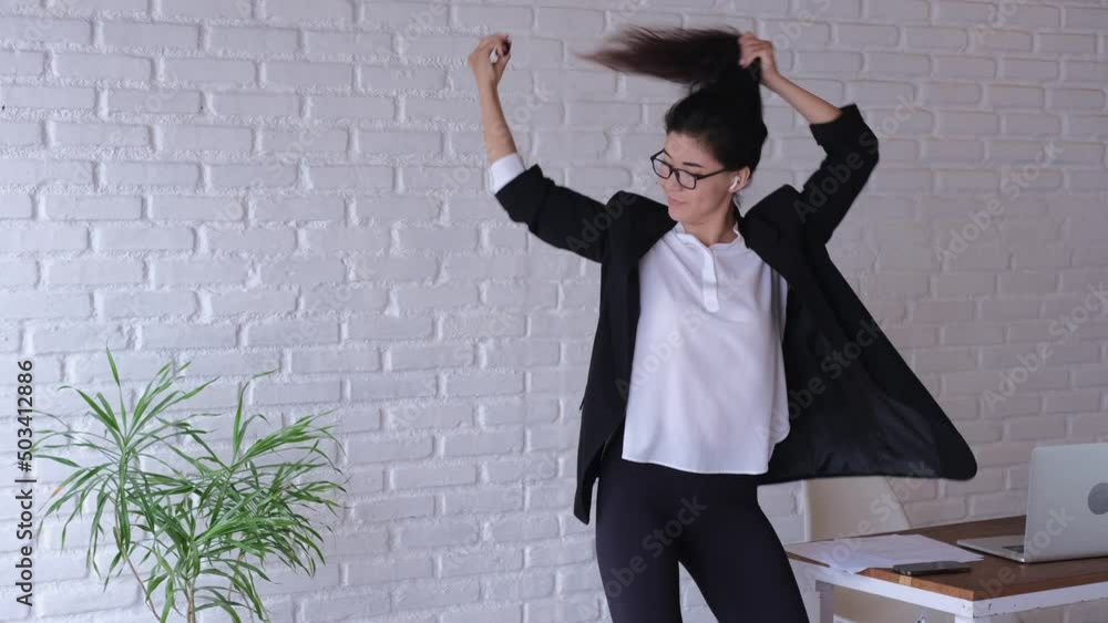 An employee of the office dances. He lets his hair down, throws a glass ...