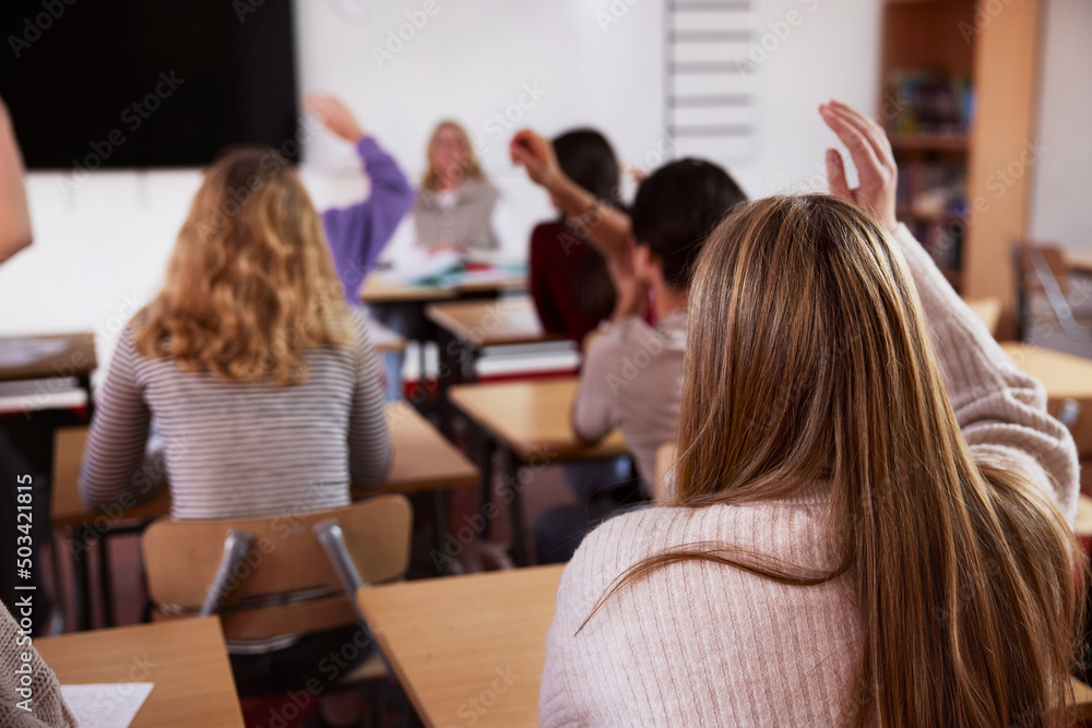 Teenagers in classroom Stock Photo | Adobe Stock