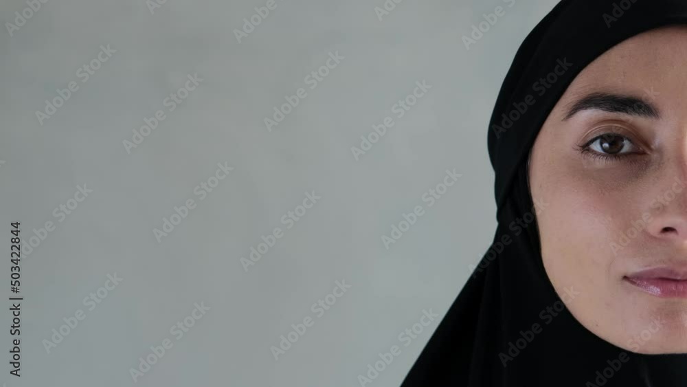 Close-up half face of arab woman in black hijab. Muslim world that ...