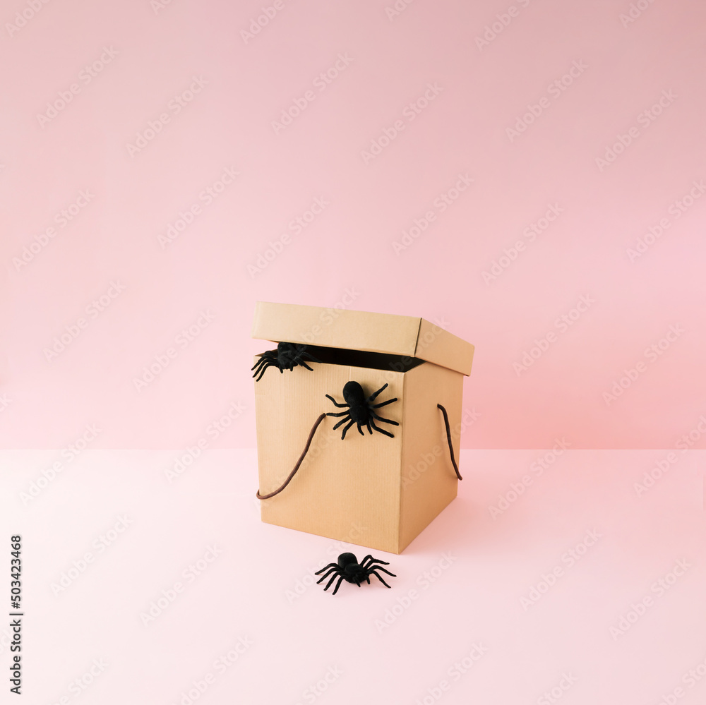 Brown delivery cardboard box with black spiders coming out of it ...