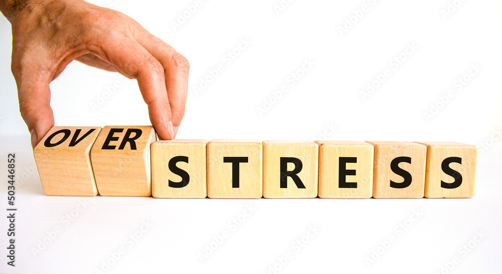 Over stress symbol. Psychologist turns wooden cubes and changes the ...
