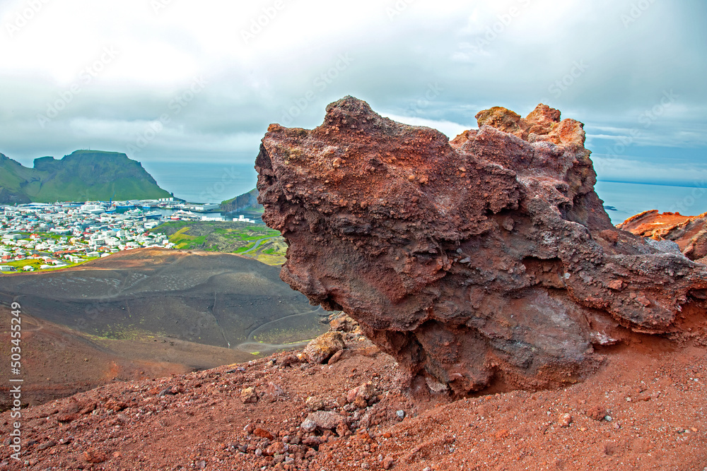 Extinct volcano eldfell on the background of the island Heimaey ...