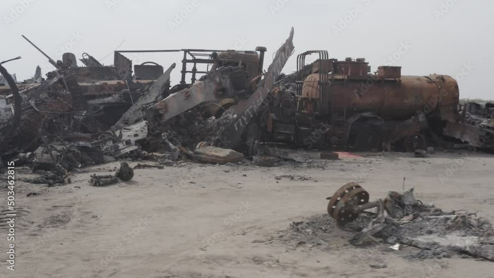 Destroyed military convoy. Burnt combat vehicles. Rusty tech ...