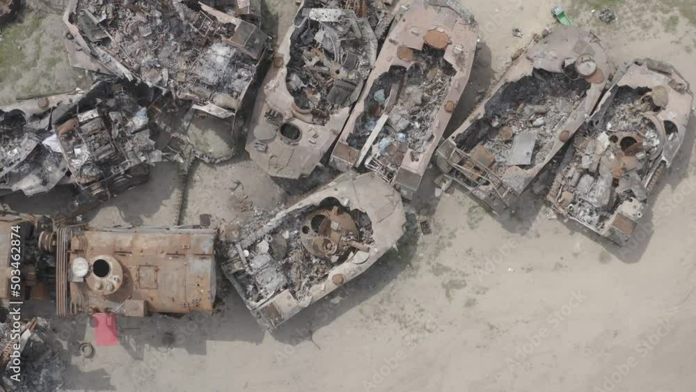 Destroyed military convoy. Burnt combat vehicles. Rusty tech ...