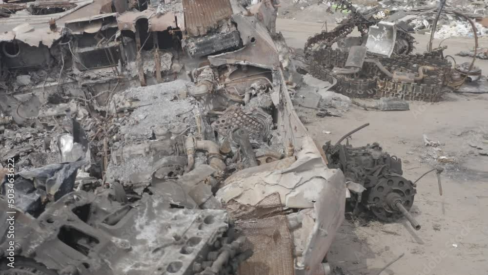 Destroyed military convoy. Burnt combat vehicles. Rusty tech ...