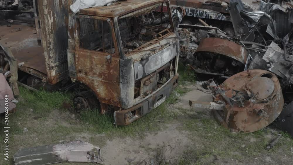 Destroyed military convoy. Burnt combat vehicles. Rusty tech ...
