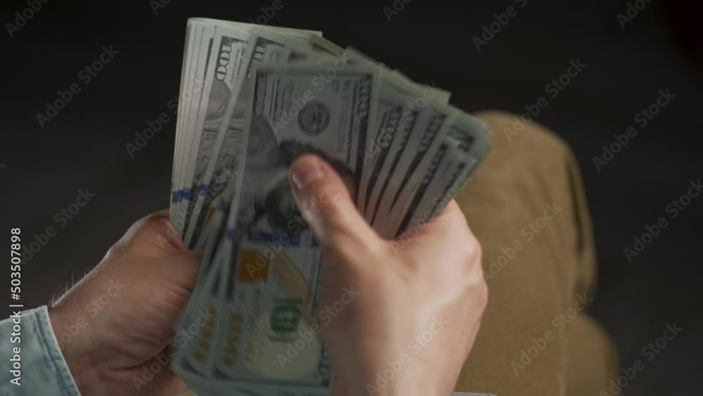 Hands counting US Dollar bills or paying in cash. Concept of investment ...