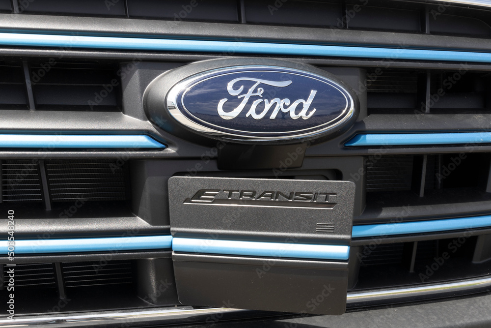 Ford E-Transit Cargo Van display at a dealership. The Ford E-Transit ...