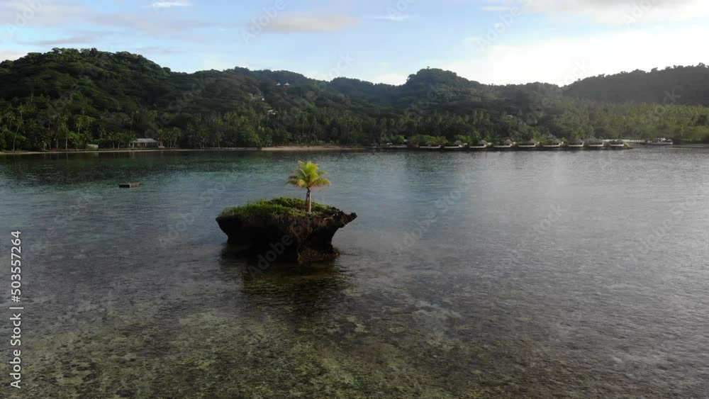 Drone footage from Fiji, orbiting a small island in the middle of the ...