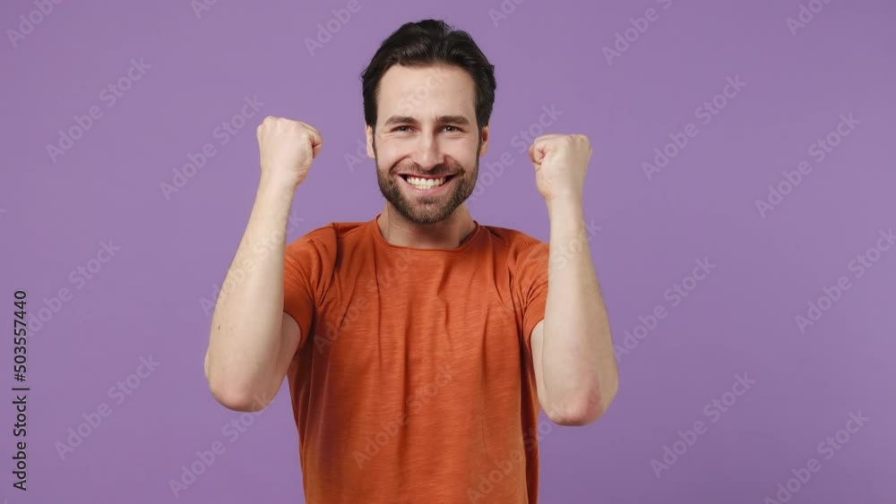 Excited jubilant happy young brunet bearded man 20s years old wears red ...