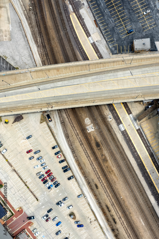 Overhead view of railroad, overpass, and parking lot in industrial part ...