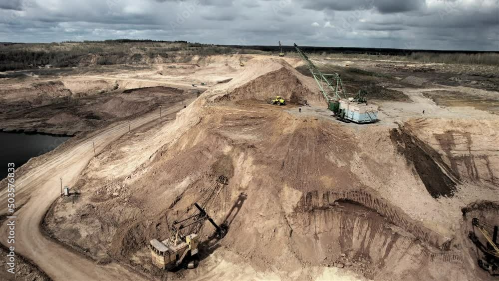 Stockvideon Mining excavator loading dolomite minerals in haul truck ...