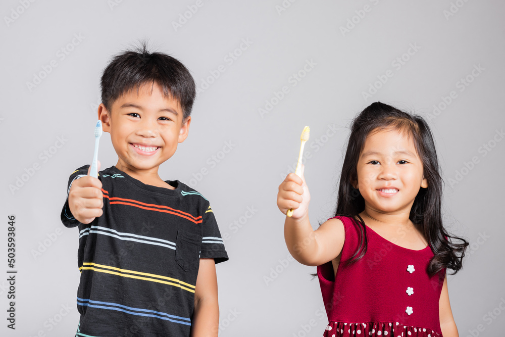 Little cute kid boy and girl 3-6 years old show brush teeth and smile ...