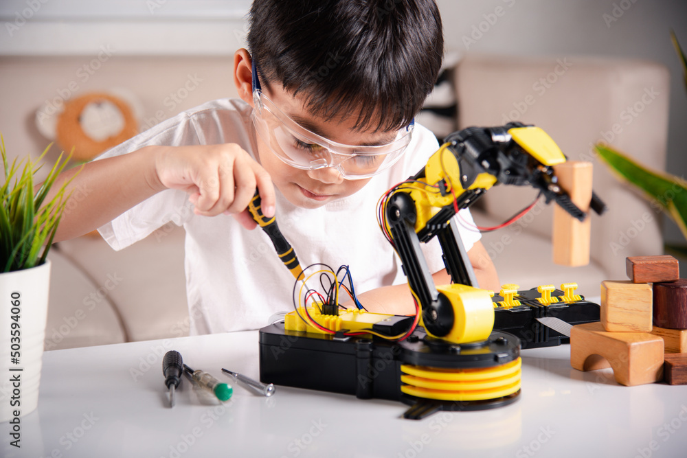 Child learning repairing getting lesson control robot arm, Happy Asian ...