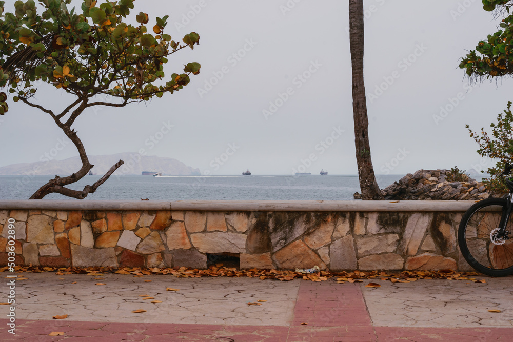 Photos of a beach on a cloudy day from different angles and places, the ...