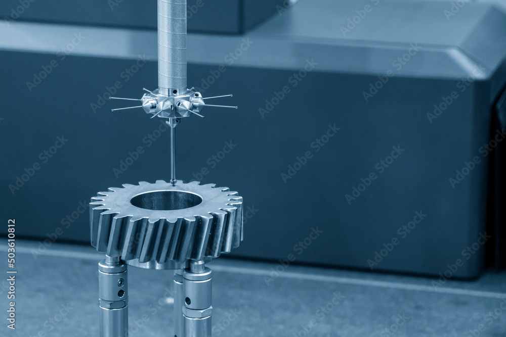 Closeup scene the touch trigger probe of CMM machine measuring the ...