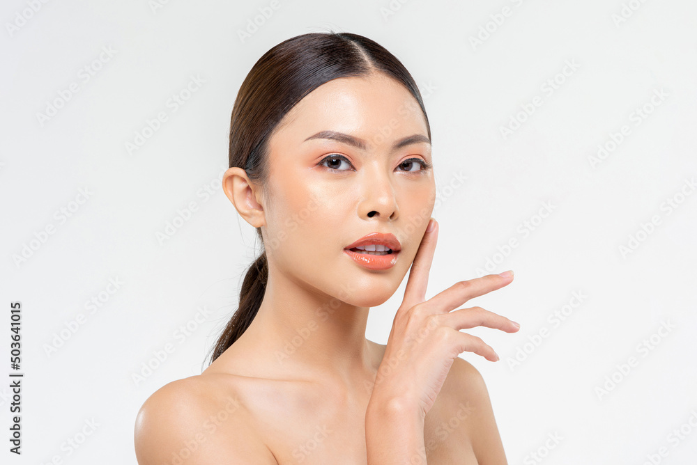 Beauty shot portrait of attractive Asian woman touching smooth skin on ...