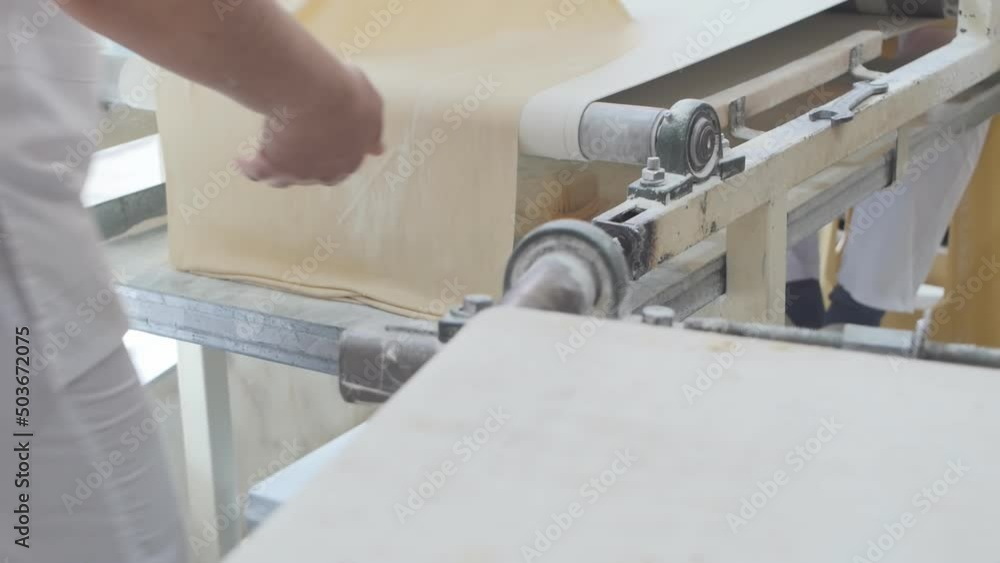 the process of baking national Armenian lavash from thin dough in a ...