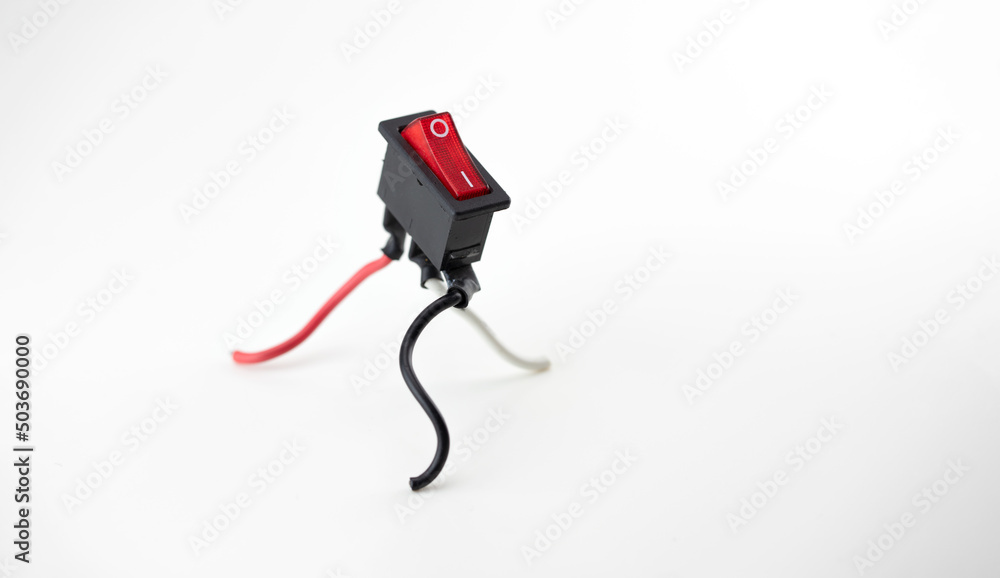 Power up. Red switch standing up with red black and white cable legs ...