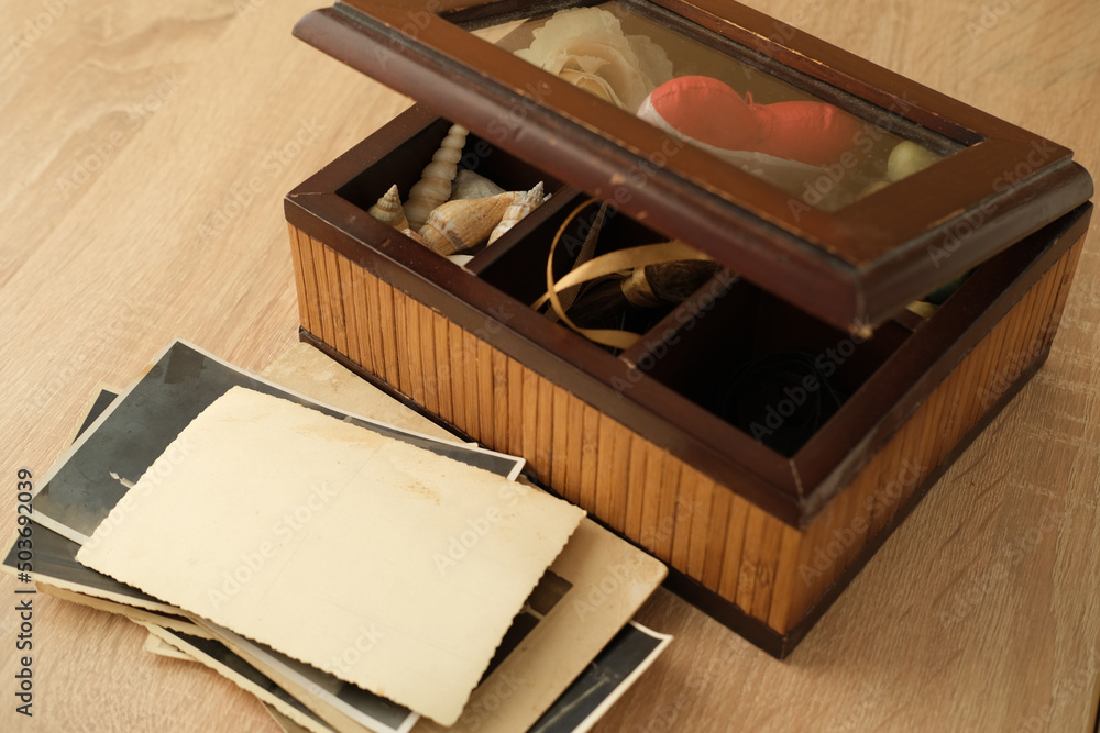 dear to heart memorabilia in an old wooden box, lock of hair, stack of ...