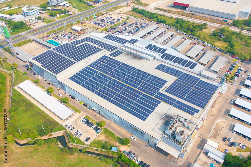 Aerial view of solar panels or solar cells on the roof of shopping mall ...