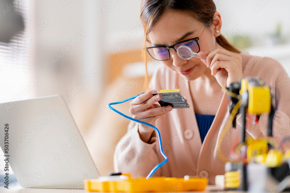 smart asian female programer learning robot arm ai coding electronic ...