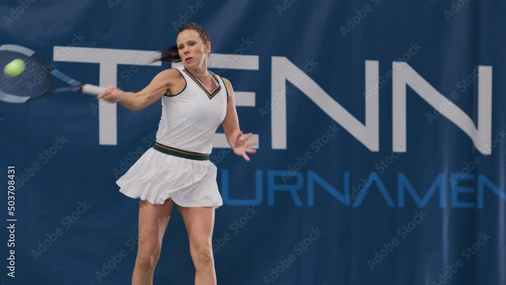 Video „Female Tennis Player Hitting Ball with a Racquet During ...