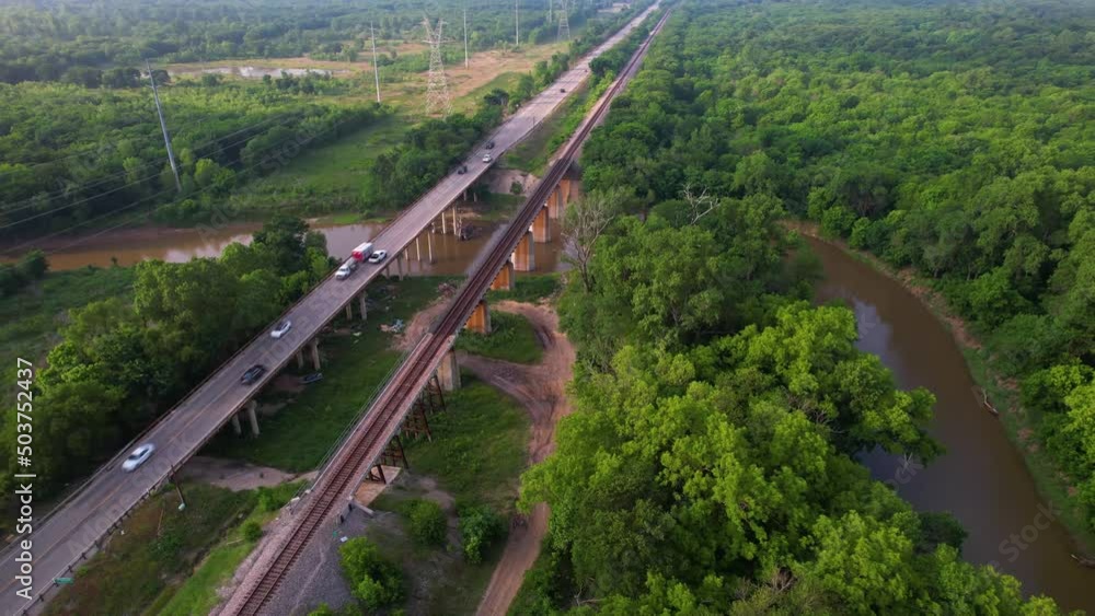 Aerial footage of highway 377 over Denton Creek in Texas. Camera is ...