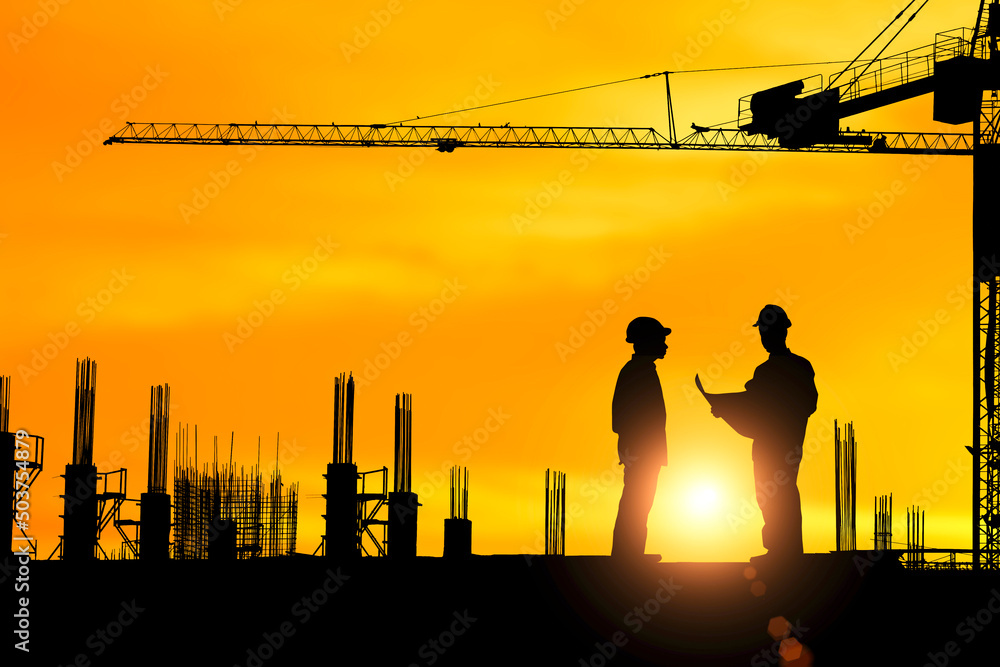 Silhouette of engineer explaining the construction worker to the ...