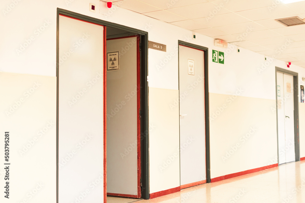 X-ray doors with hazardous radiation signs, the sign reads room 3, in a ...
