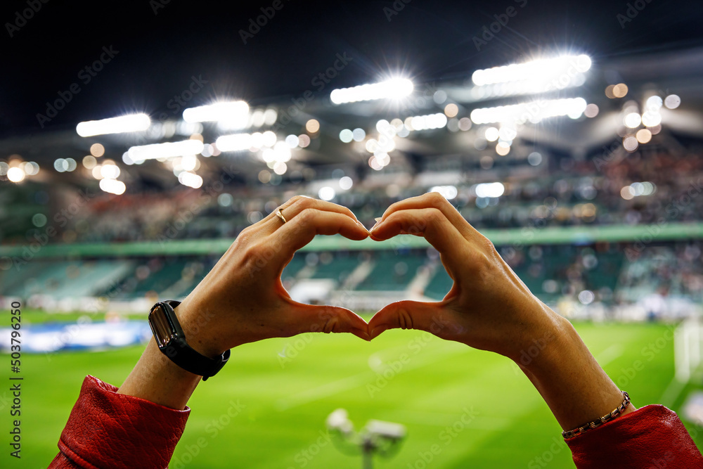 She loves this team. Heart shape for the favorite football club during ...