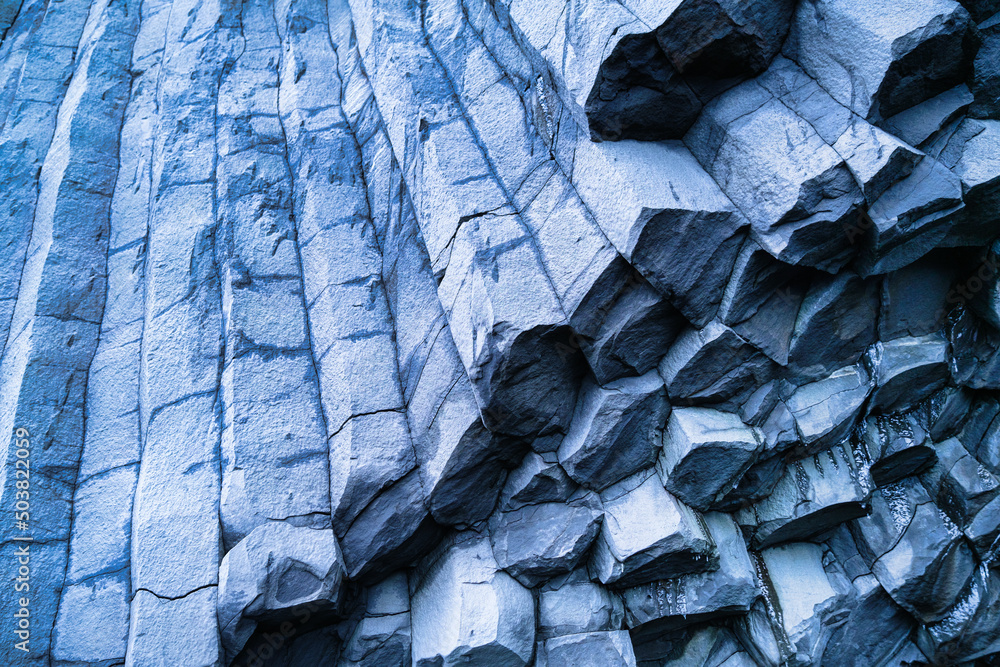 Basalt stones as a background. Reynisfjara Beach, Iceland. Sharp rocks ...