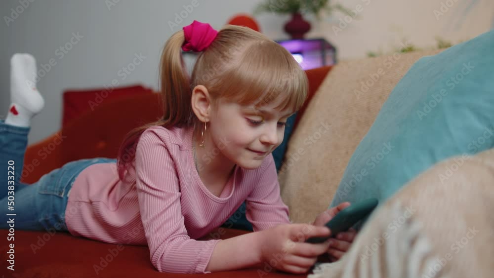 Little one school kid girl children using mobile phone technology ...