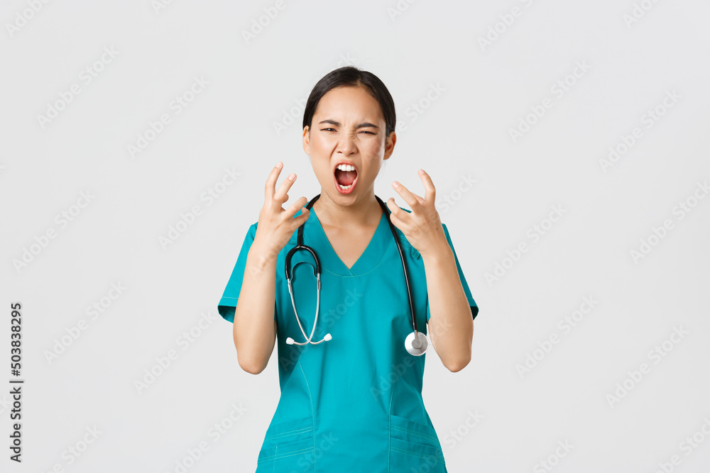 Covid-19, healthcare workers and preventing virus concept. Angry pissed ...