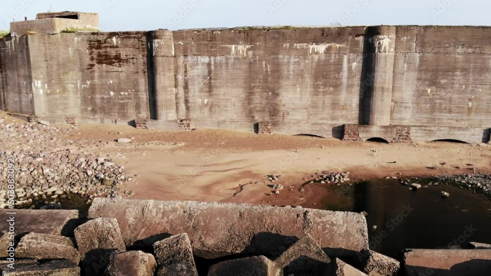 Surrounding wall has collapsed, sand dam is eroded, and underground ...