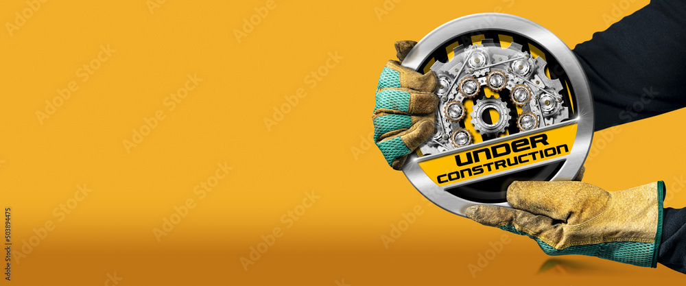 Manual worker with protective work gloves holding an under construction ...