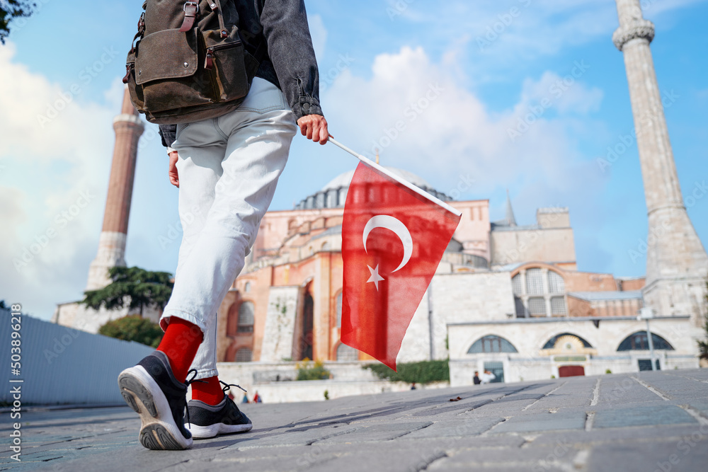 Enjoying vacation in Istanbul. Tourist with national turkish flag ...